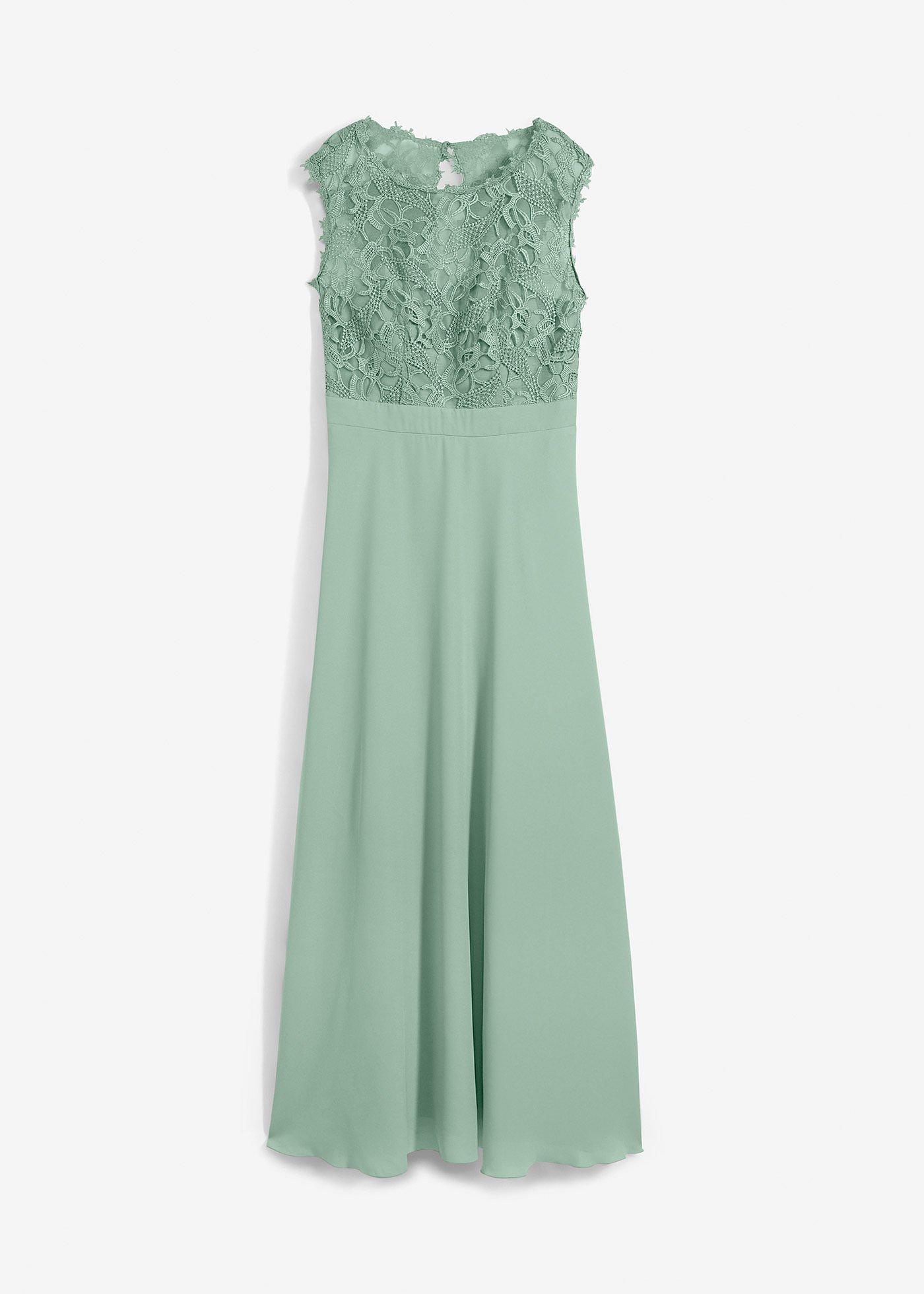 Chique galajurk met een cut-out op de rug en versieringen van kant ...